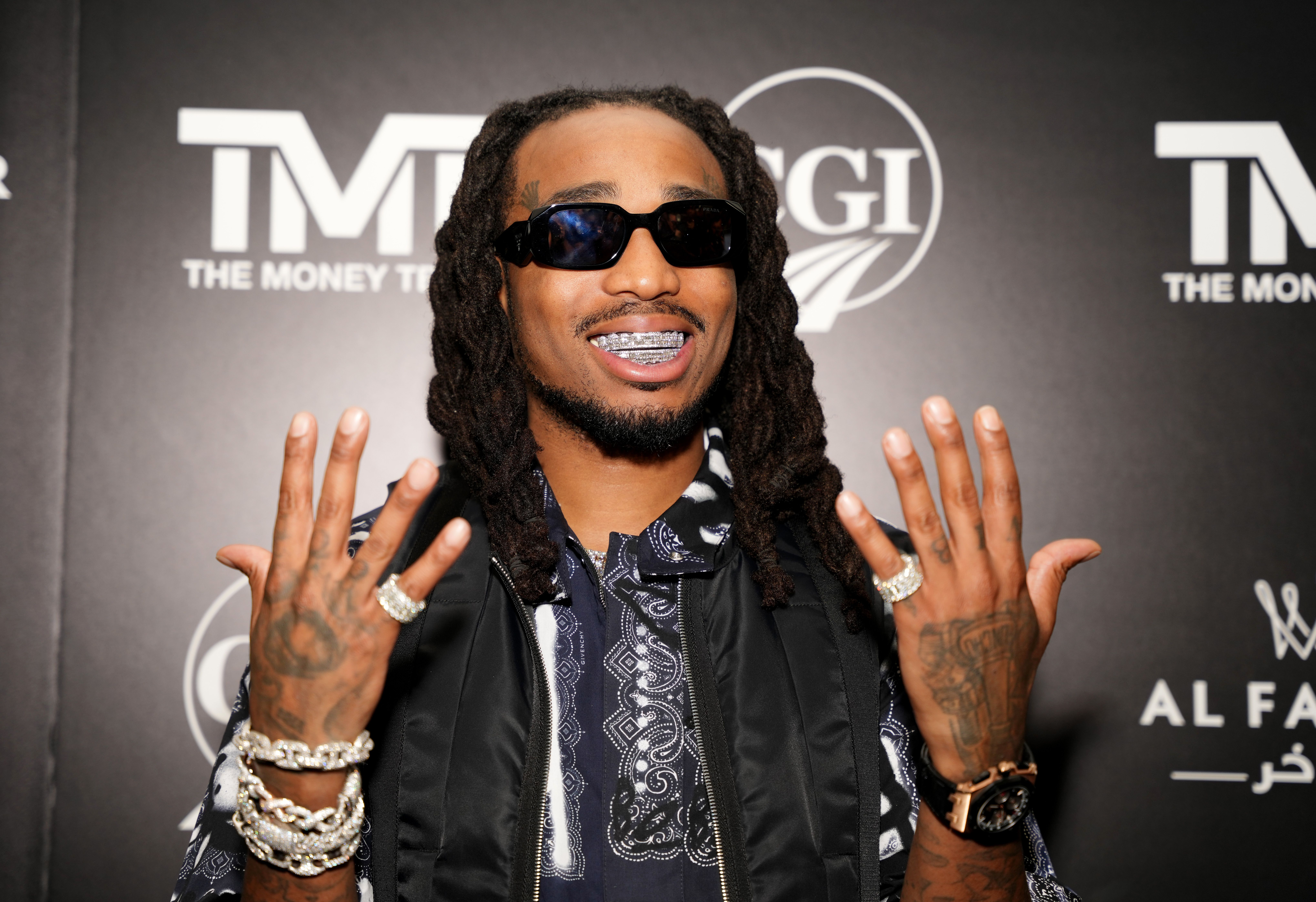 Quavo Poses Alongside Superfan With His Face Tattooed On Their Back