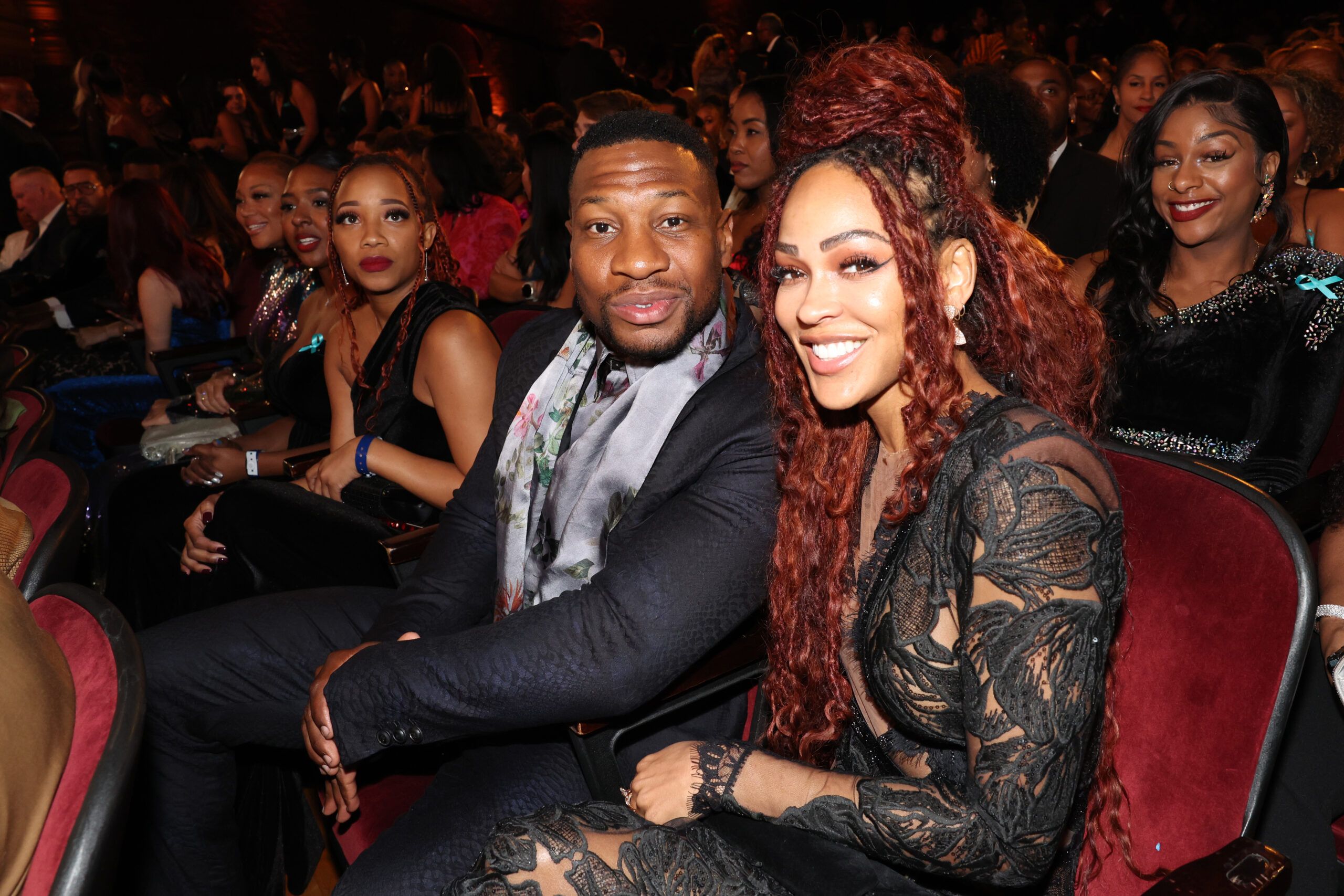 Jonathan Majors & Meagan Good's Awkward Red Carpet Kiss Causes Fan Debate