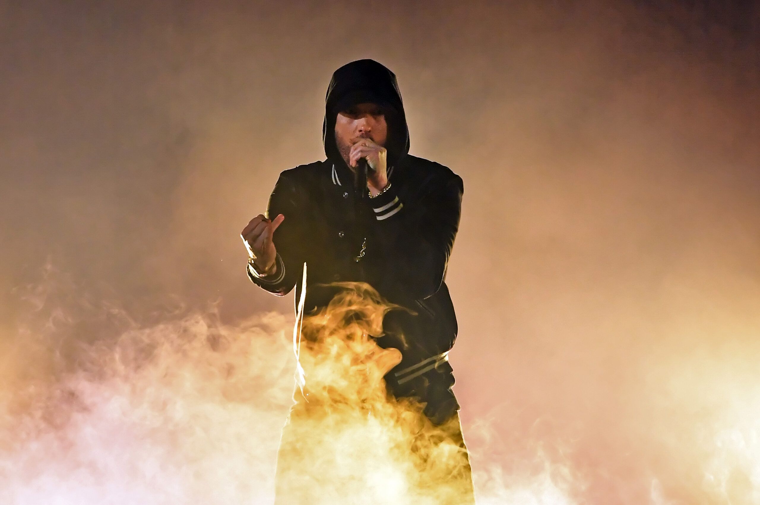 Eminem Embraces "HAWK TUAH" Meme While Visiting Slim Shady's Gravesite