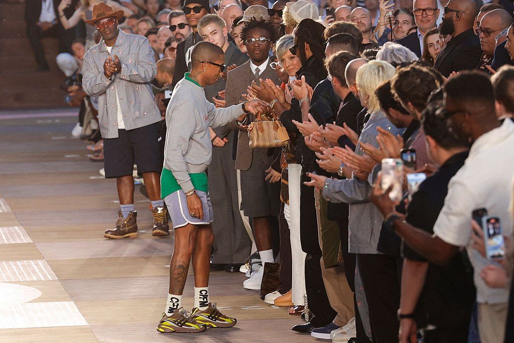 Pharrell Williams Hand Delivers LV Bag To Beyoncé Off Runway