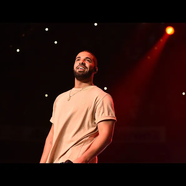 Drake Dodges Fans' Bras, Shoes, & More On Stage In Detroit
