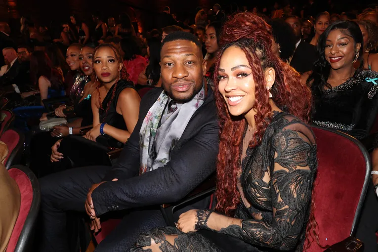 Jonathan Majors & Meagan Good's Awkward Red Carpet Kiss Causes Fan Debate