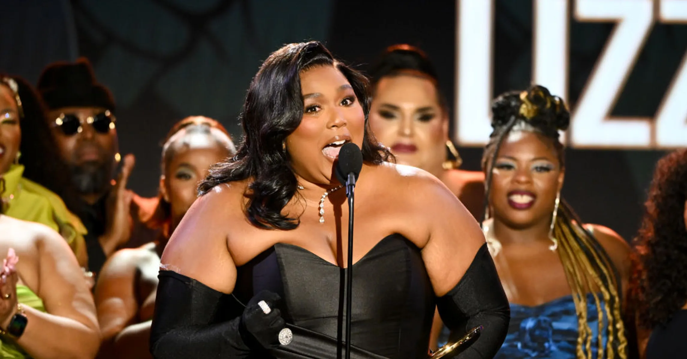 Lizzo Gets Emotional Accepting Humanitarian Award With Current Dancers ...