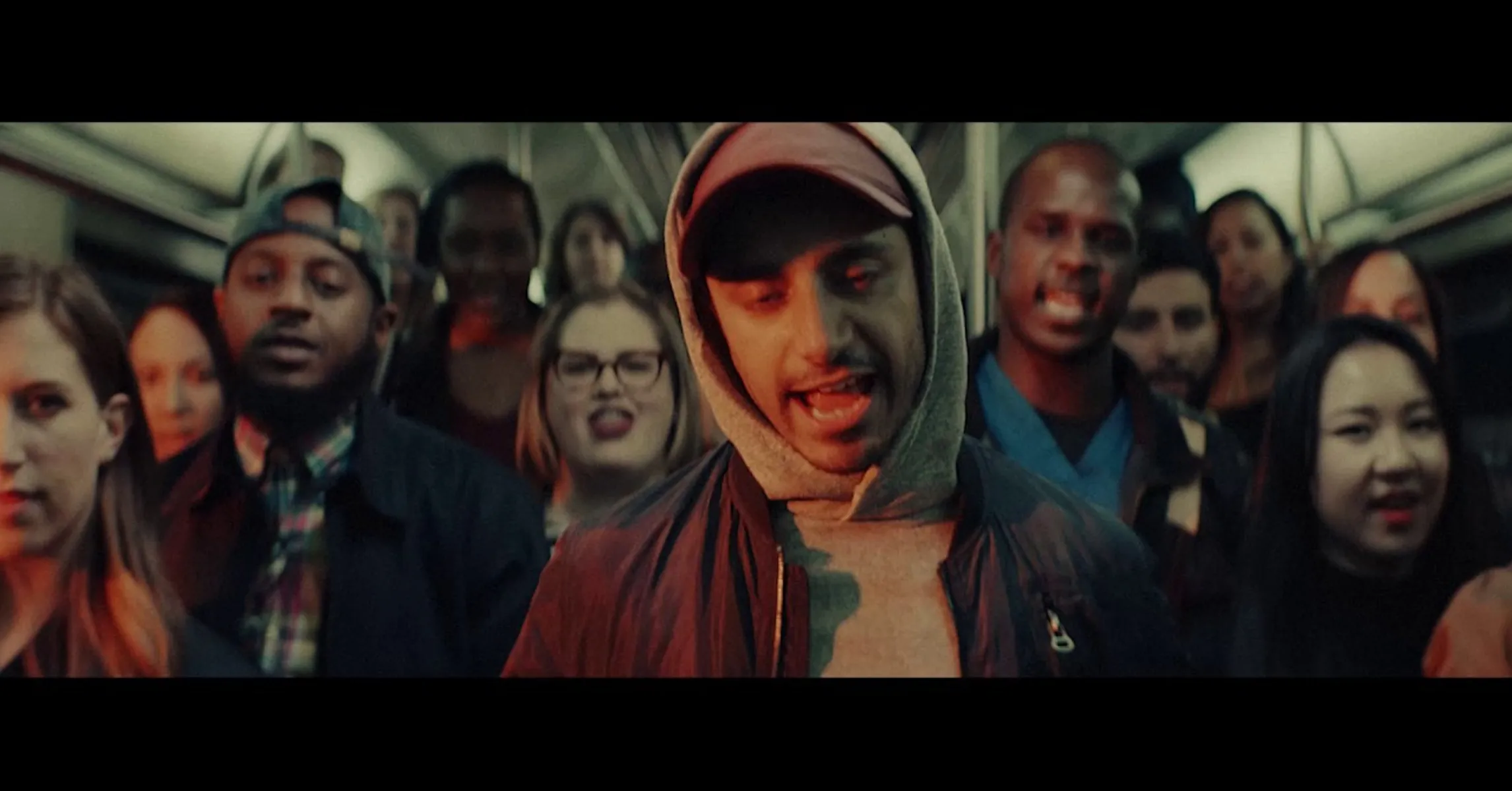 K'naan Feat. Snow Tha Product, Residente, Riz MC "Immigrants (We Get ...