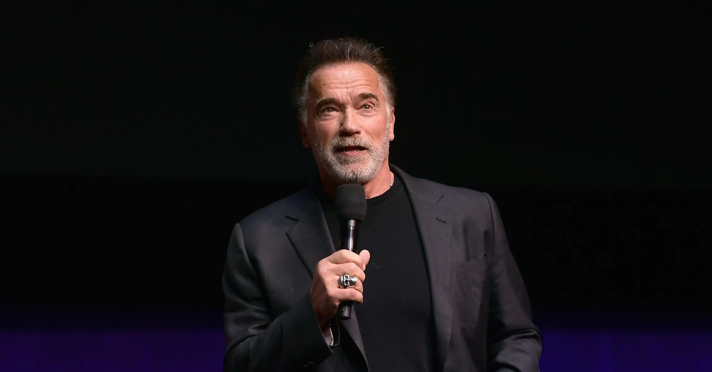 Arnold Schwarzenegger Drop Kicked By Deranged Fan & Barely Flinches