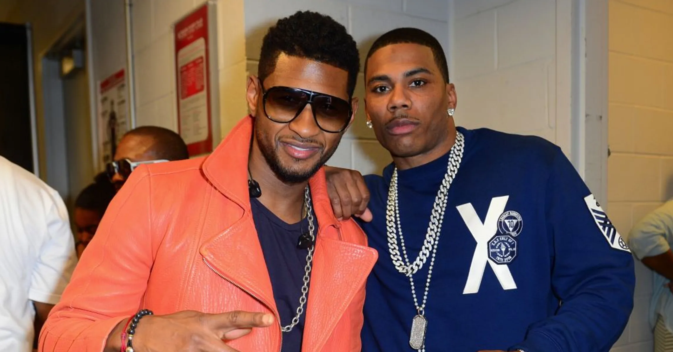 Nelly Shows Off His "Usher Bucks"