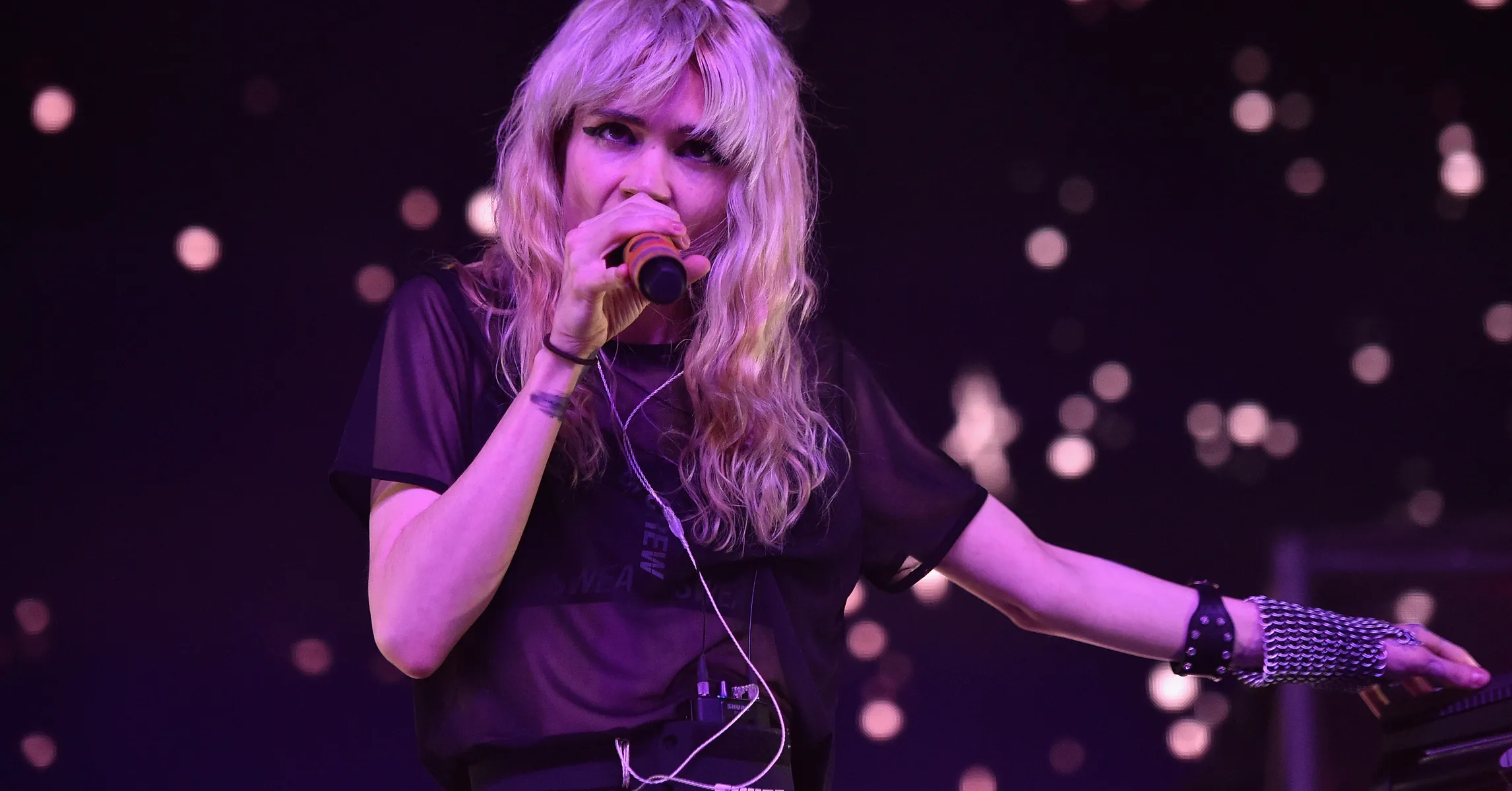 Grimes Explains Viral Pics Of Her Reading "The Communist Manifesto"