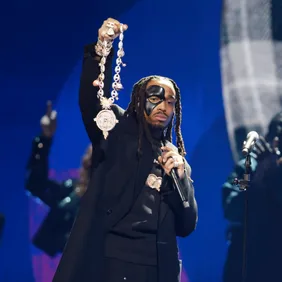 Quavo Poses Alongside Superfan With His Face Tattooed On Their Back