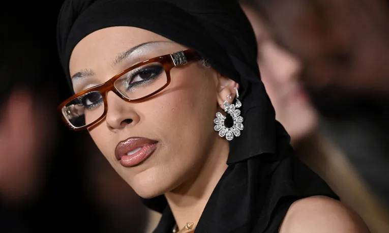 Doja Cat Teases Her Vivacious Curves In Black One-Piece